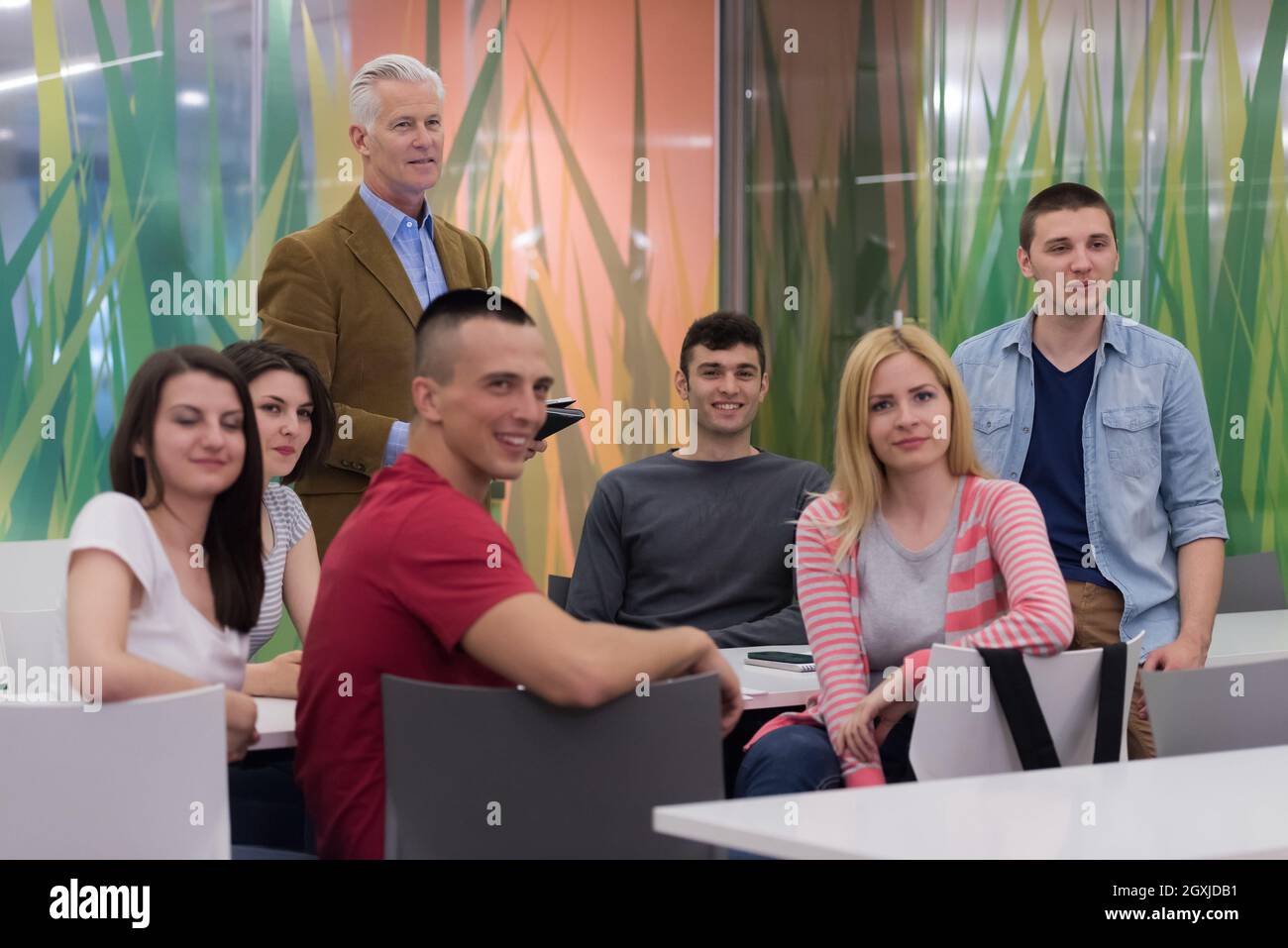 technology students group in computer lab school classroom working on ...