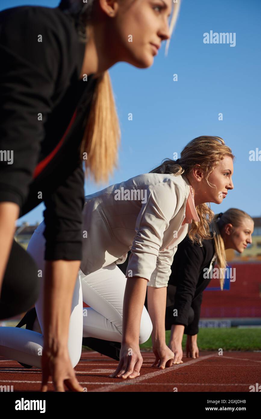 business people running together on racing track Stock Photo - Alamy