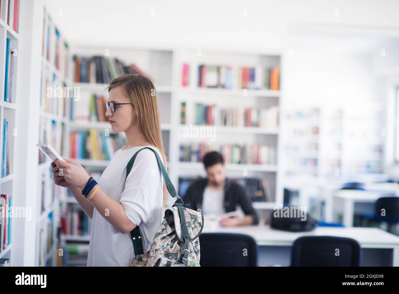 smart looking famale student girl in collage school library selecting ... smart looking famale student girl in collage school library selecting ...