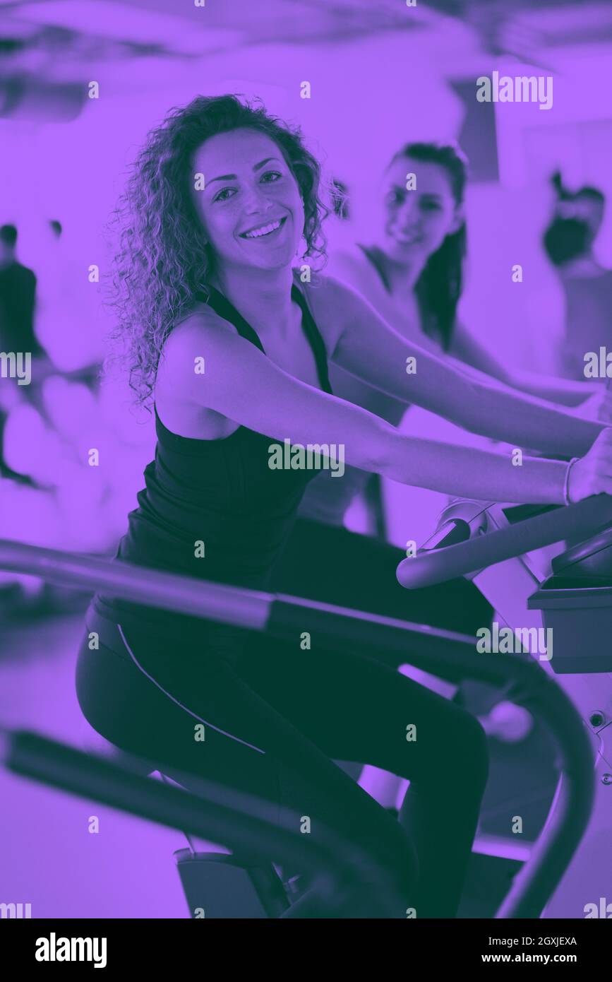 group of young people running on treadmills in modern sport gym duo ...