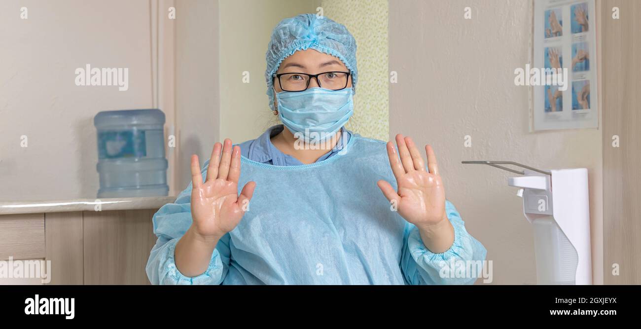 banner with a medical worker in a disposable medical suit, a medical ...