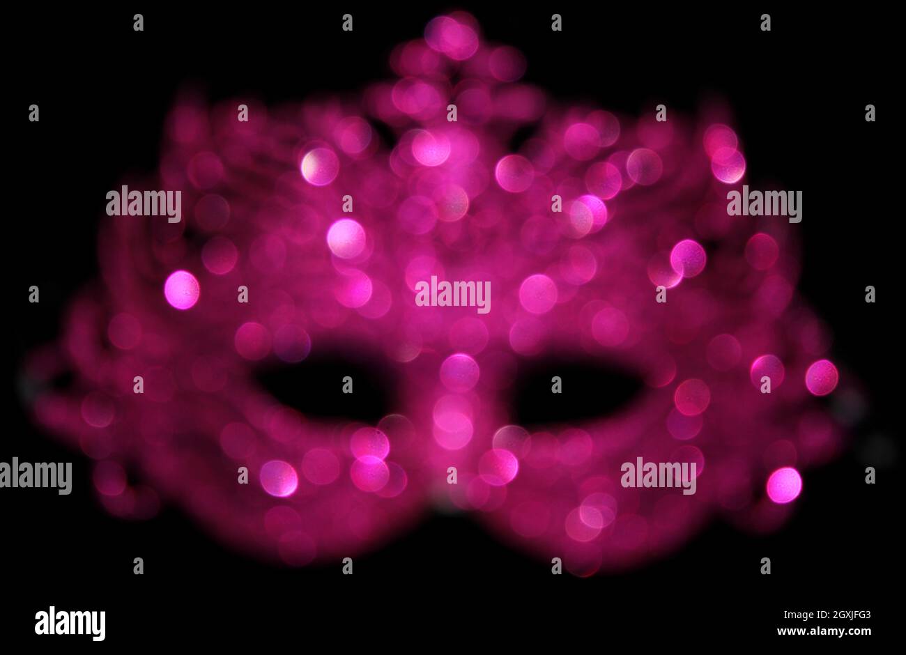 Blurred Pink Carnival Mask Bokeh Stock Photo - Alamy