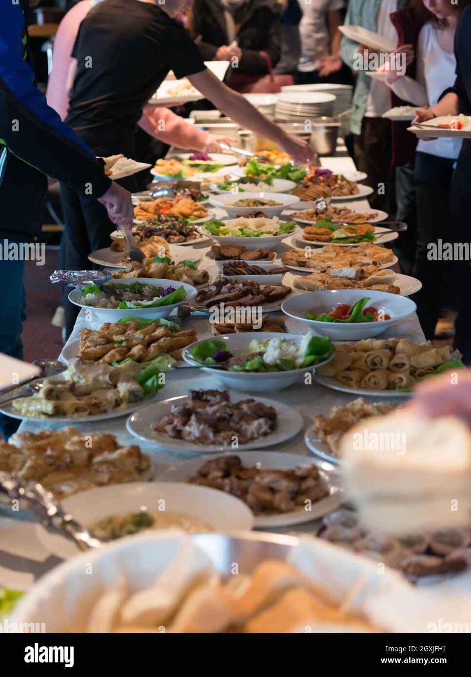 people group catering buffet food indoor in school restaurant with meat ...