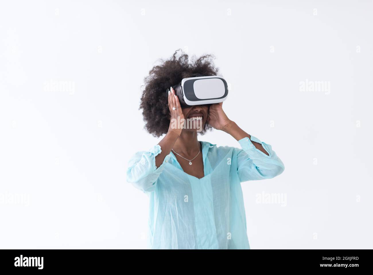 Happy african american girl getting experience using VR headset glasses ...