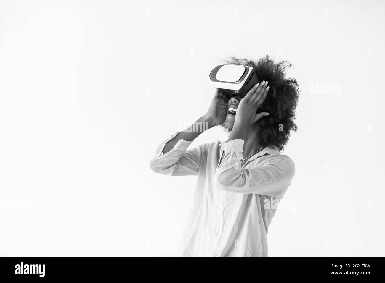 Happy african american girl getting experience using VR headset glasses ...