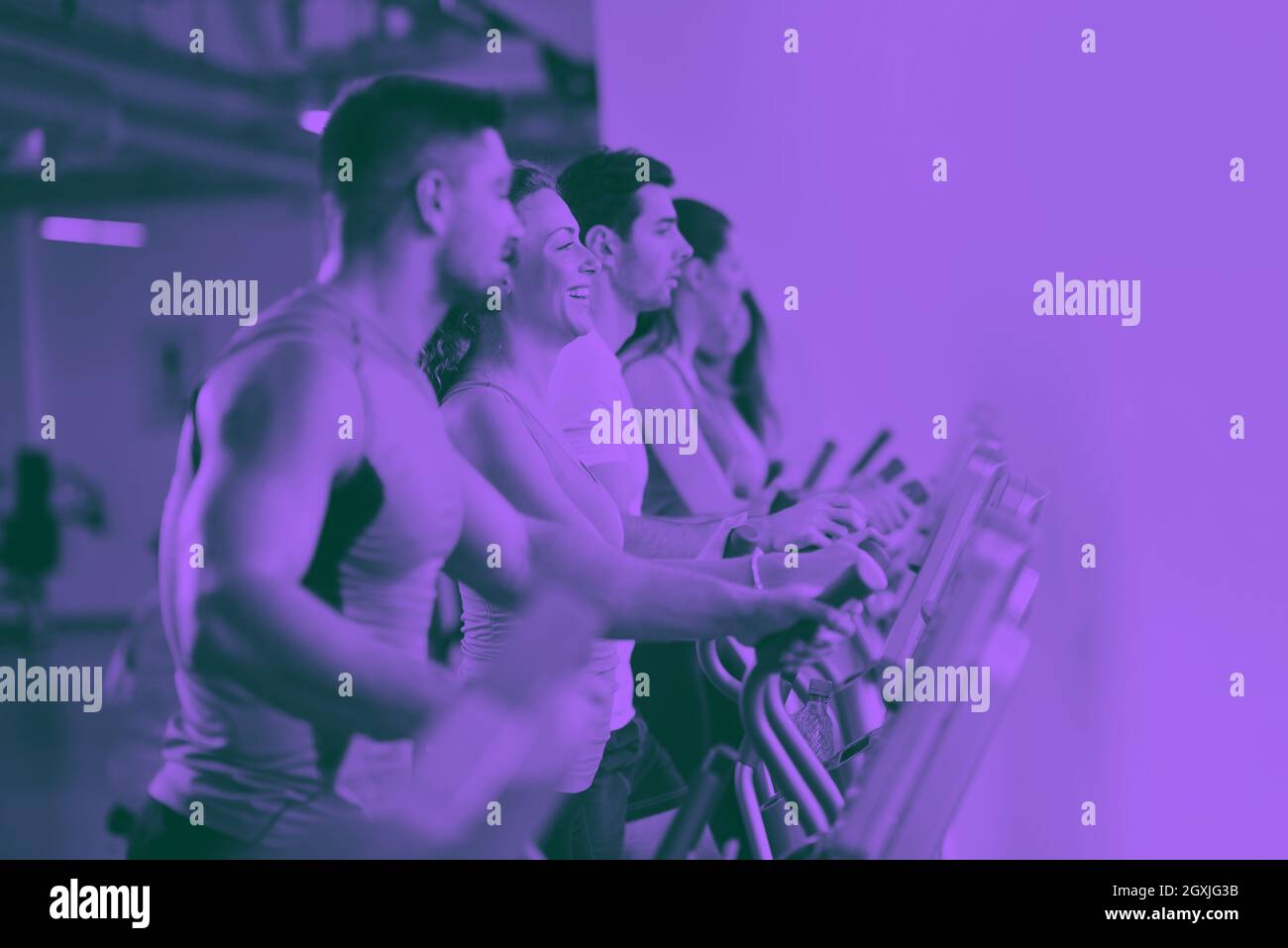 group of young people running on treadmills in modern sport gym duo ...