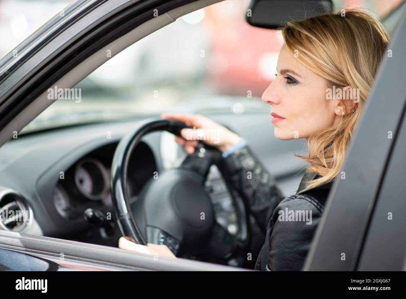 Woman driving her car Stock Photo - Alamy