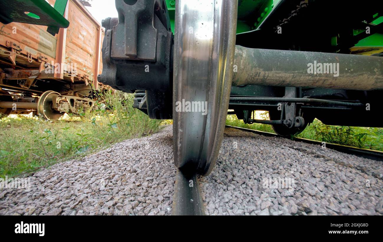 Closeup photo of polished metal surface of cargo train wagon on railway ...