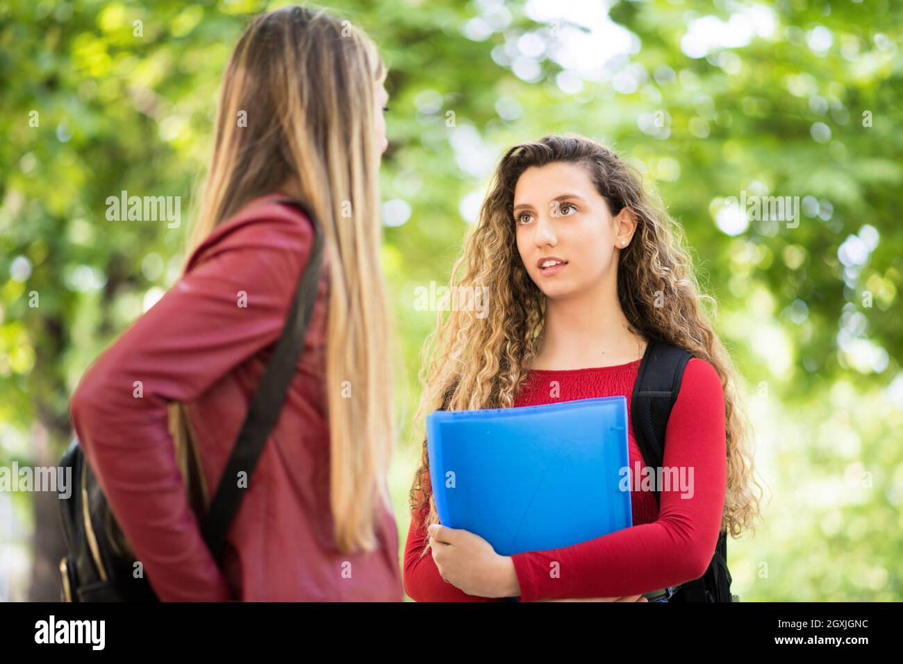Female students having a conversation outdoor Stock Photo - Alamy