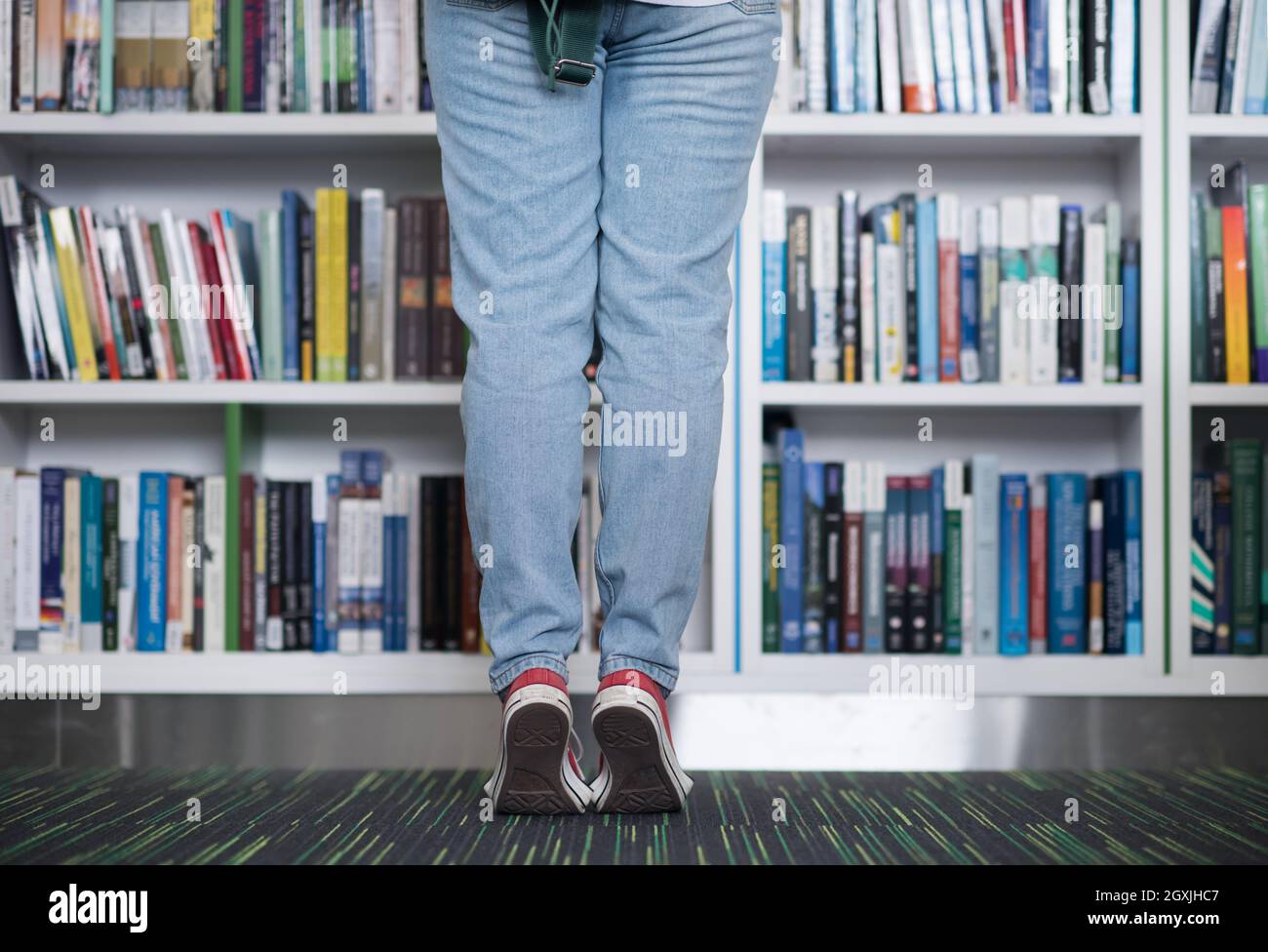 smart looking famale student girl in collage school library selecting ... smart looking famale student girl in collage school library selecting ...