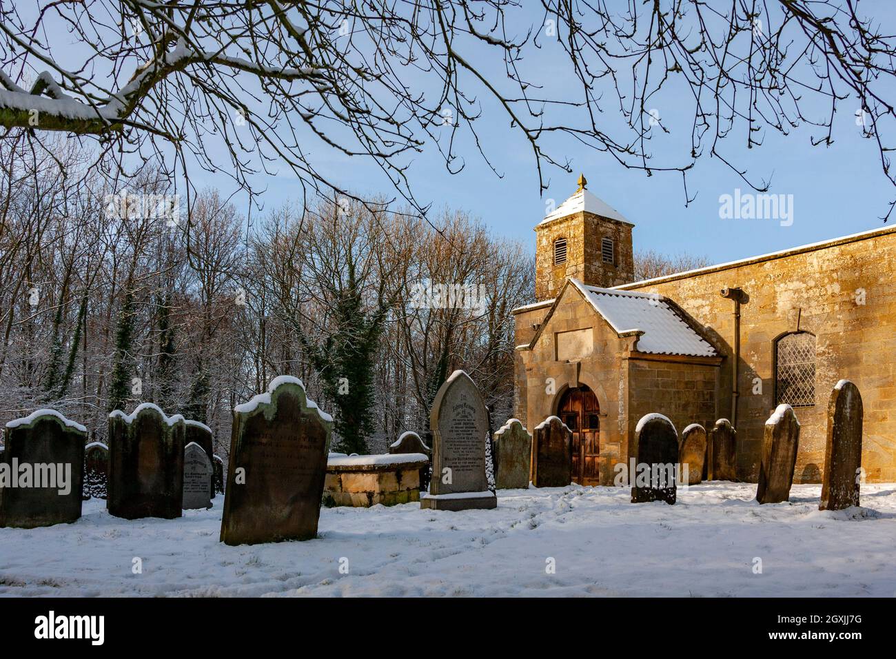 Winter snow in a Parish church and graveyard on the North York Moors in ...