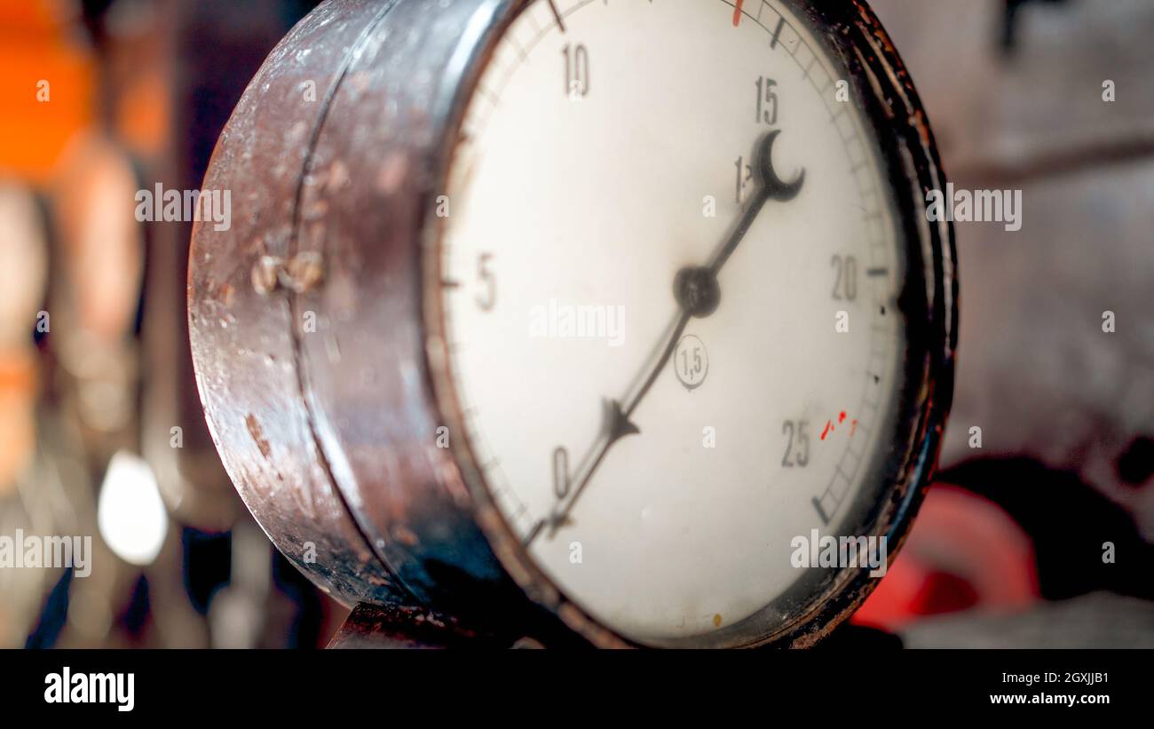 Macro image of dial and pointer on retro manometer at steam power ...