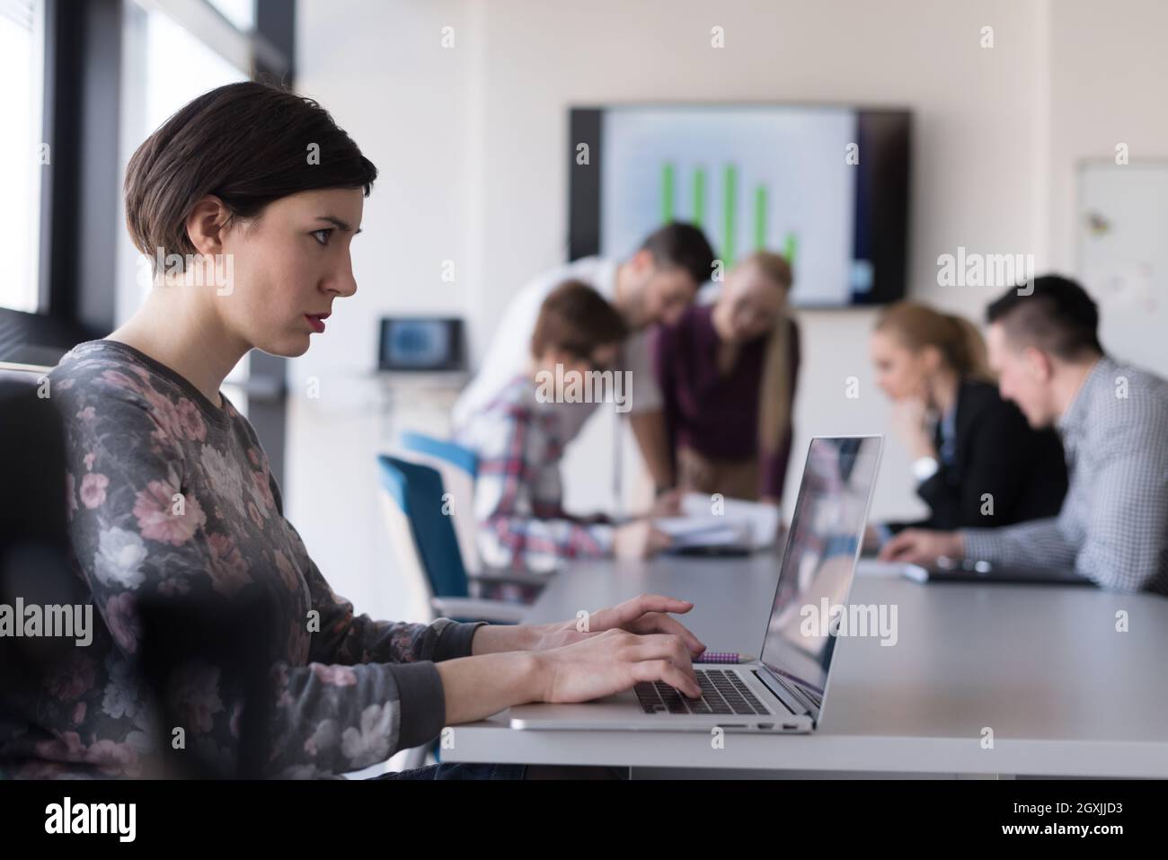 young business woman at modern startup office interior working on ...