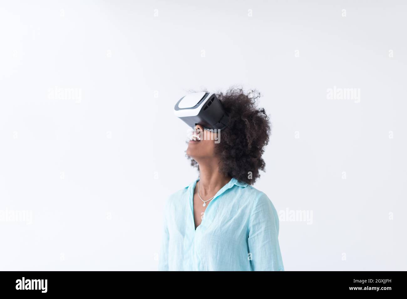 Happy african american girl getting experience using VR headset glasses ...