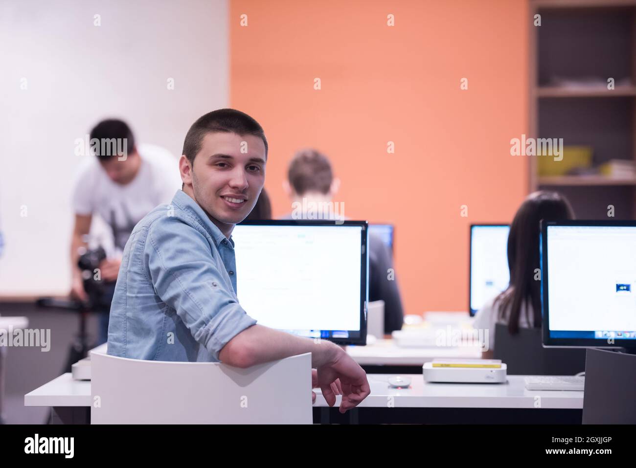 technology students group in computer lab school classroom working on ...