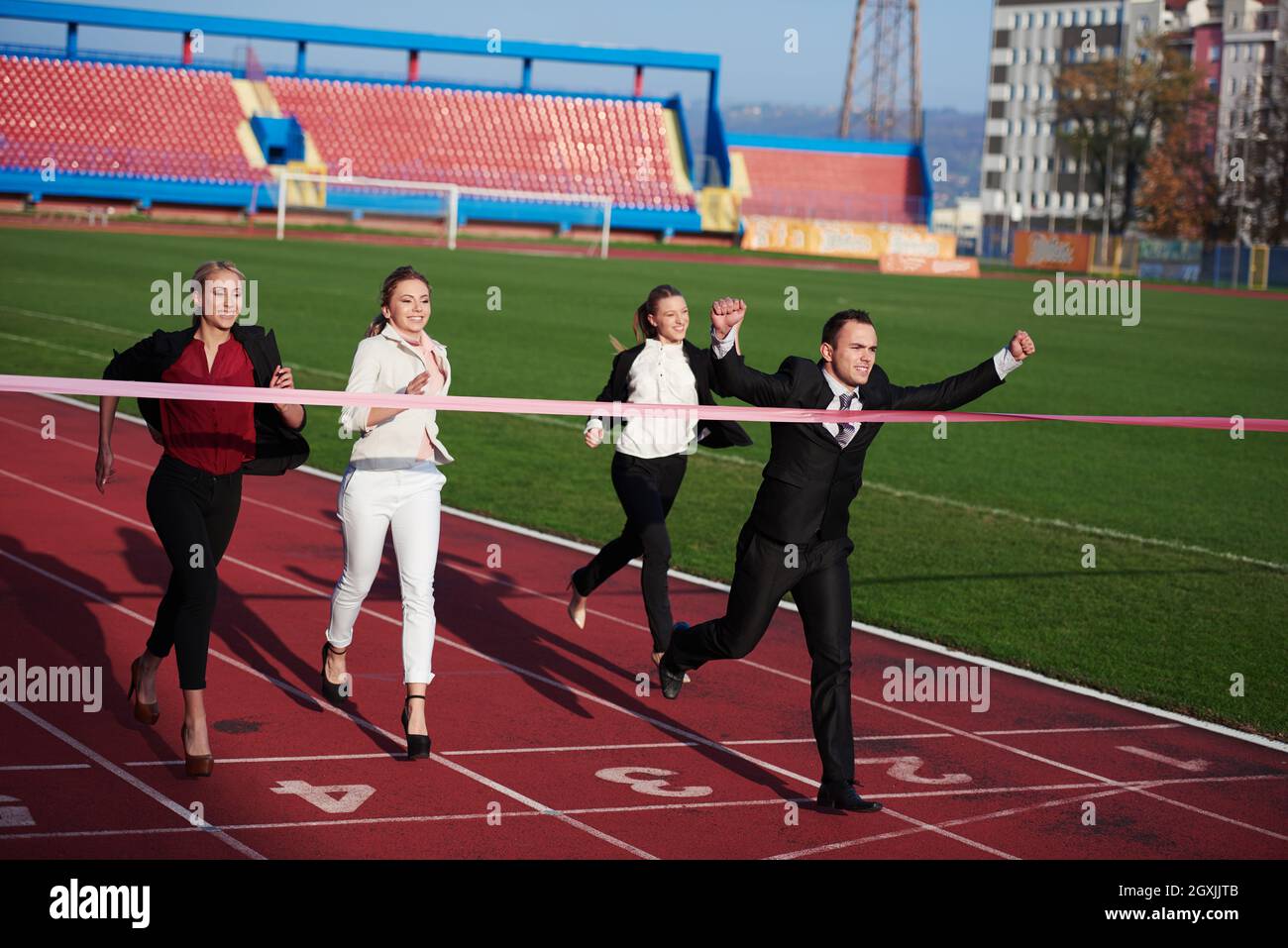 business people running together on racing track Stock Photo - Alamy