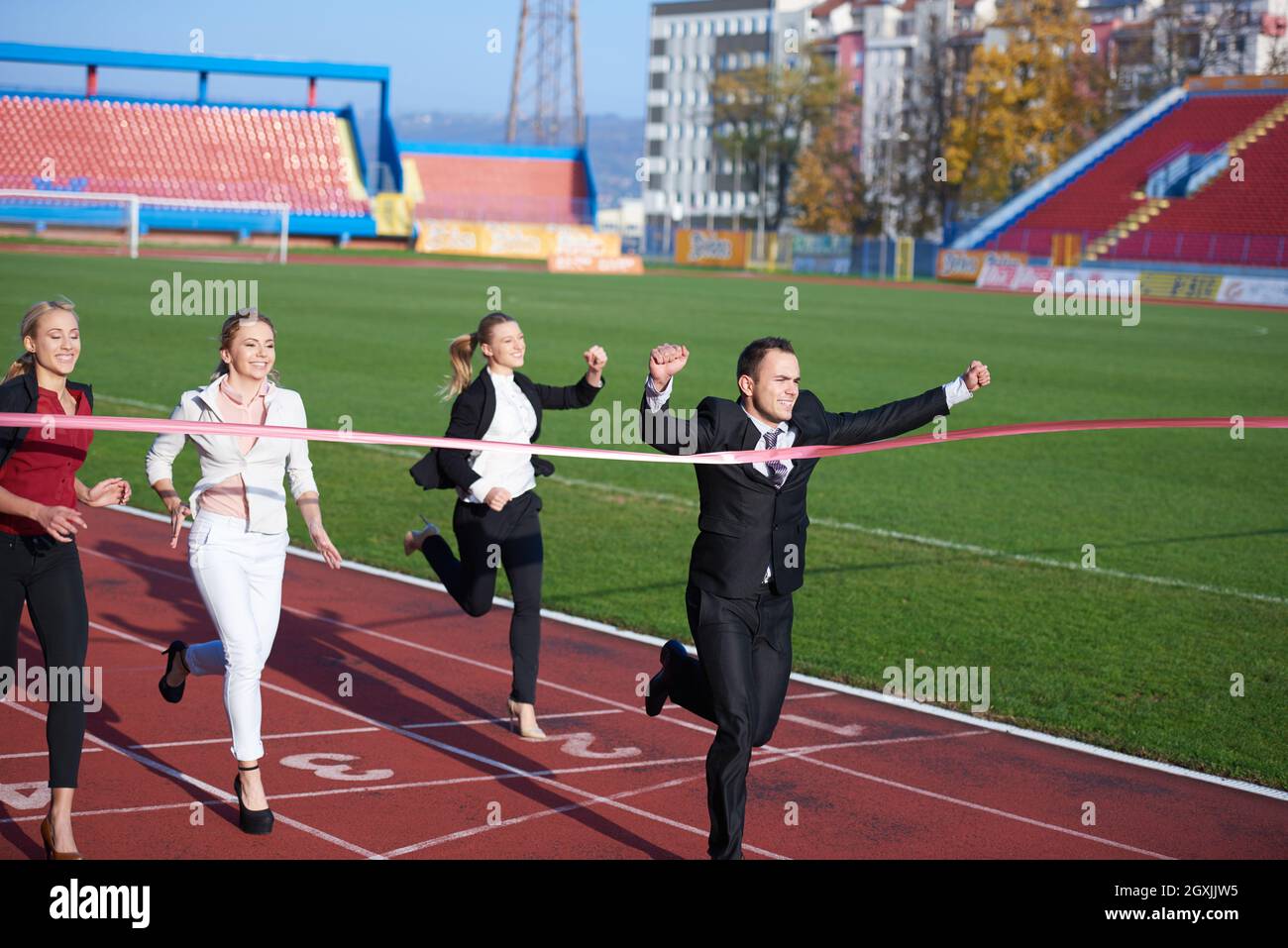business people running together on athletics racing track Stock Photo ...