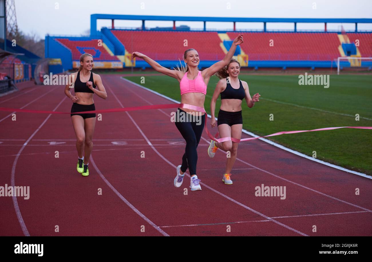 Smiling happy female runners finish female runner hi-res stock ...