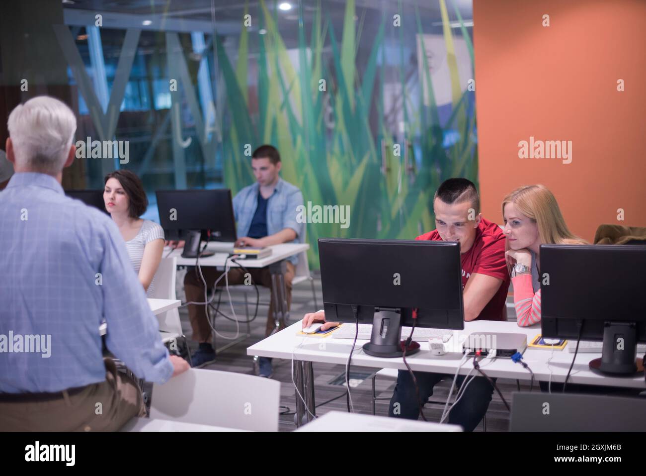 technology students group in computer lab school classroom working on ...