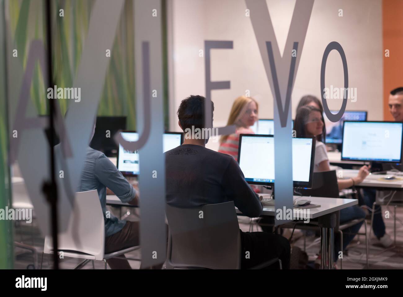 technology students group in computer lab school classroom working on ...