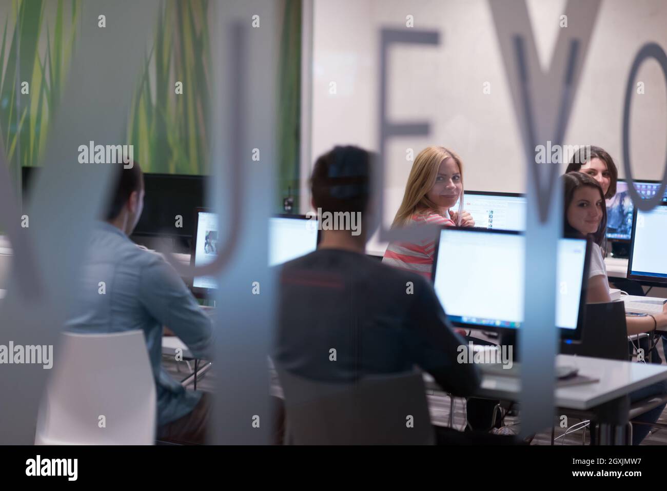technology students group in computer lab school classroom working on ...