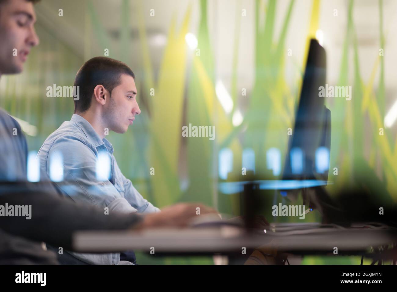technology students group in computer lab school classroom working on ...