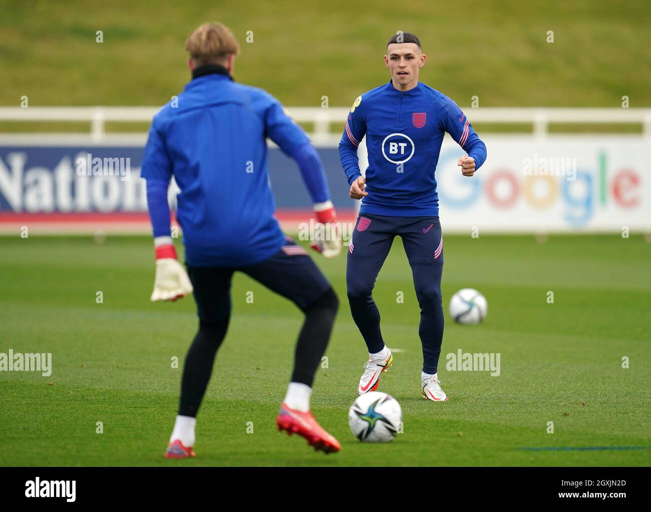England's Jordan Pickford (left) and Phil Foden during a training ...
