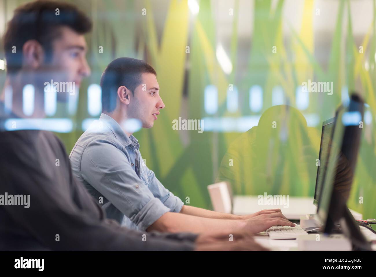 technology students group in computer lab school classroom working on ...