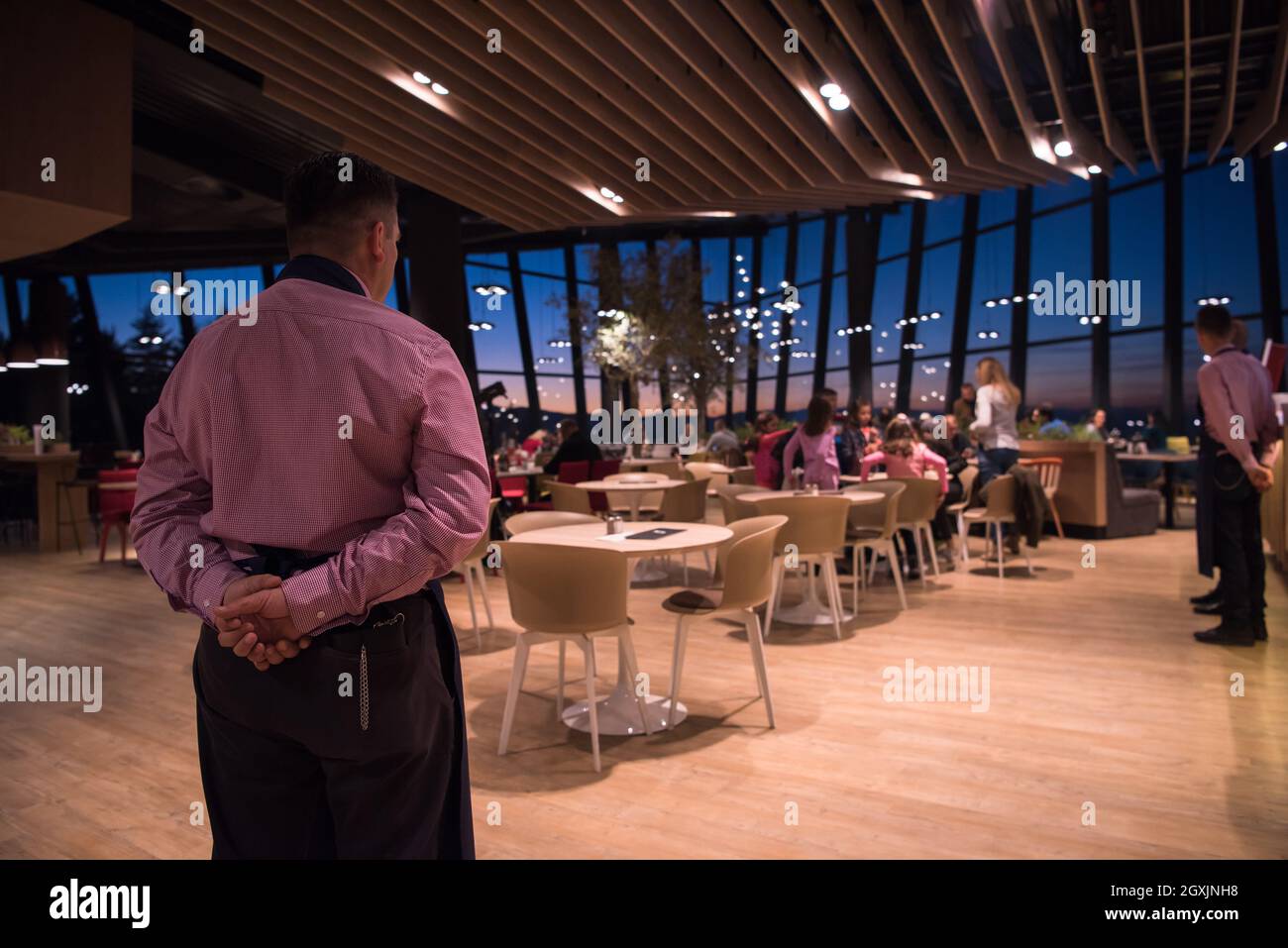 Male waiter with apron rear view hi-res stock photography and images ...
