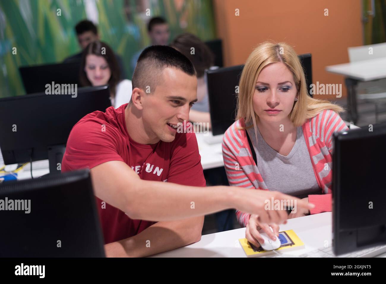 technology students group in computer lab school classroom working on ...
