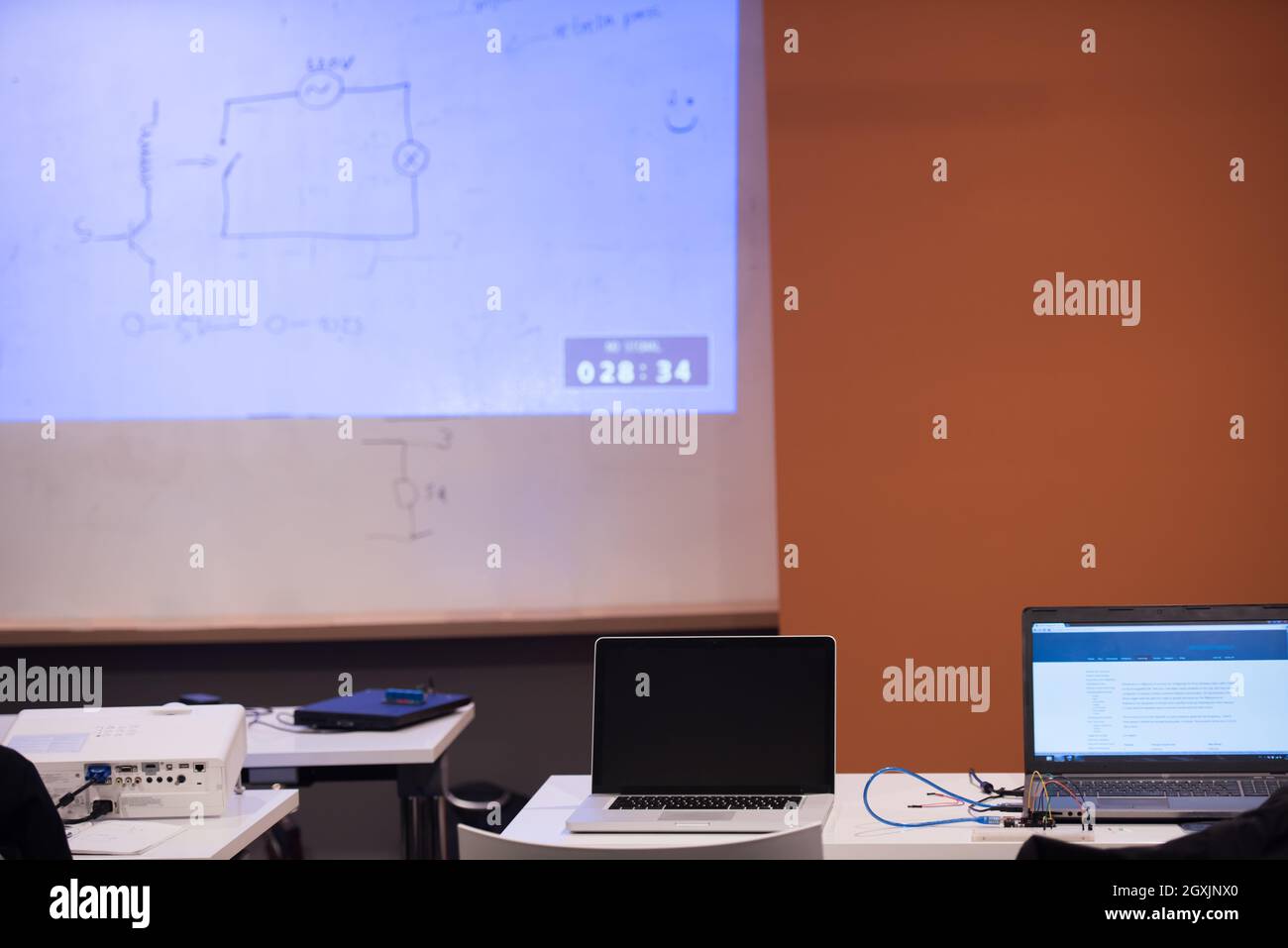 empty it classroom with program code on projector screen and modern ...