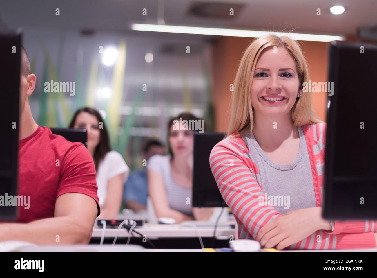 technology students group in computer lab school classroom working on ...