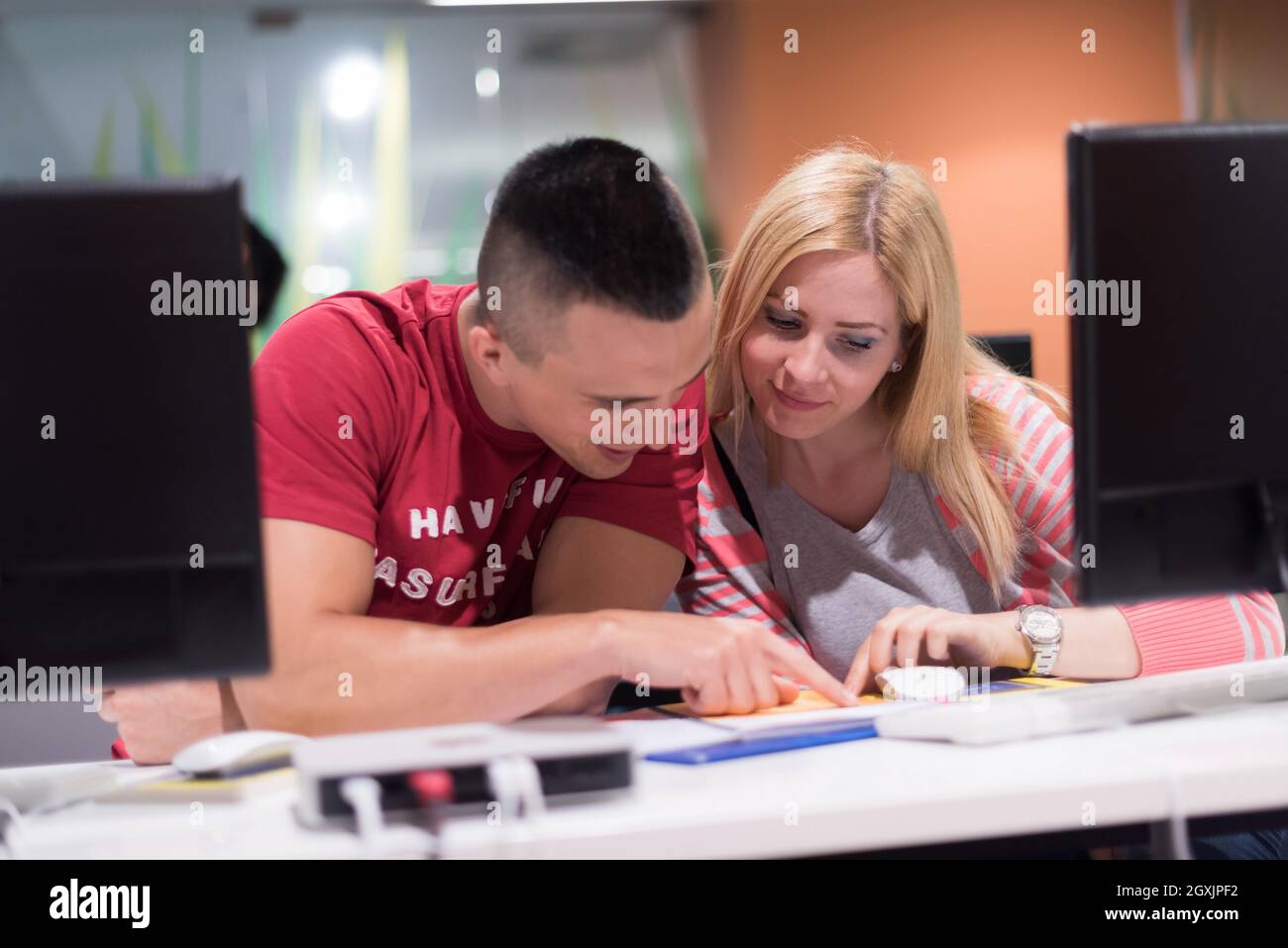 technology students group in computer lab school classroom working on ...
