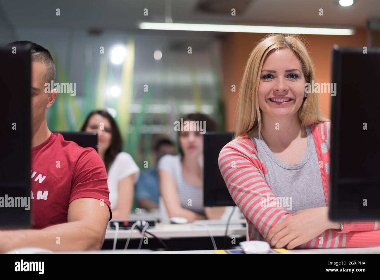 technology students group in computer lab school classroom working on ...