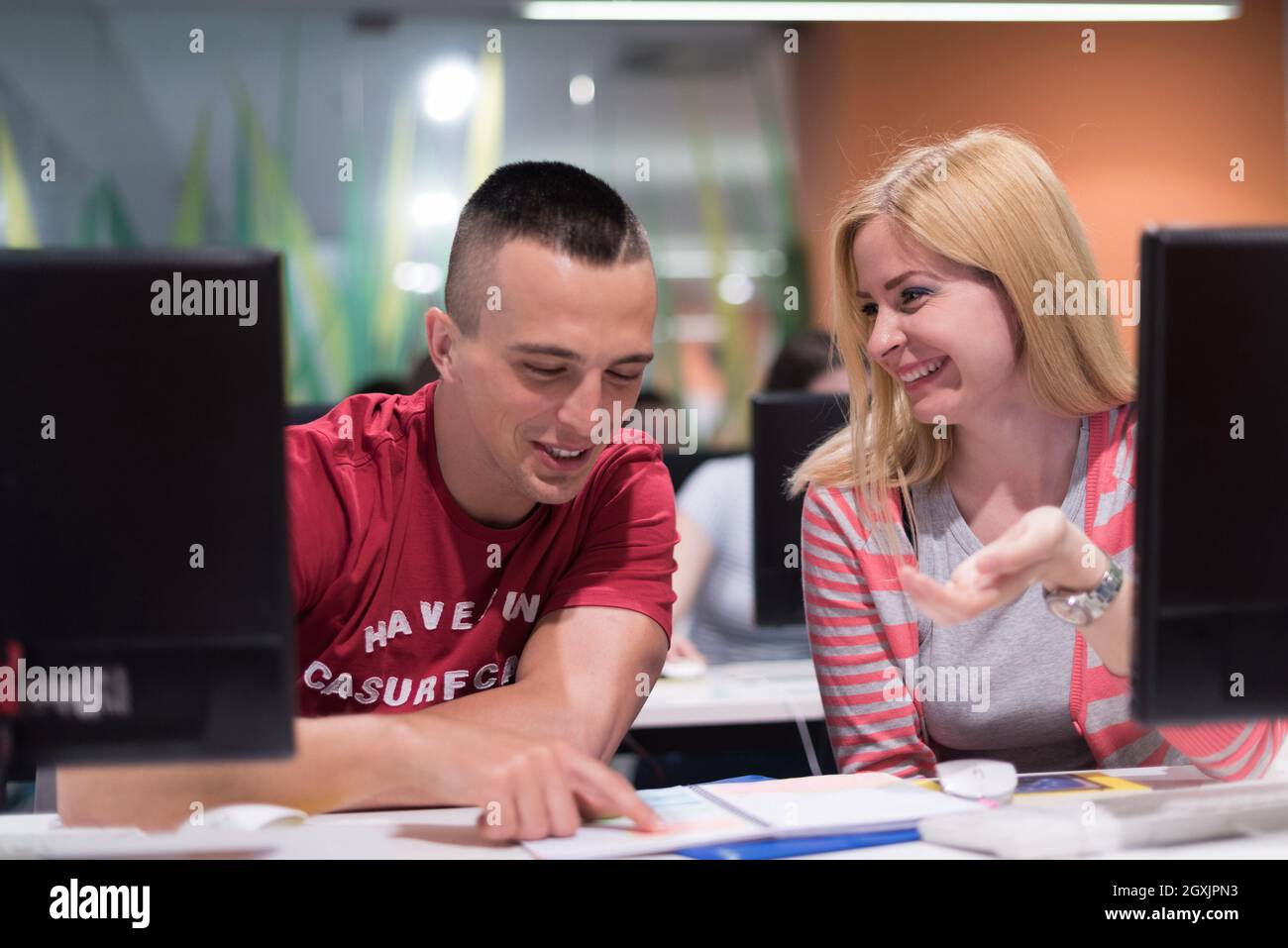 technology students group in computer lab school classroom working on ...