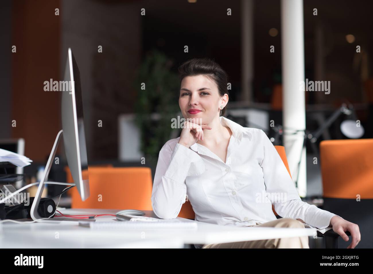 happy young business woman relaxing and geting insiration while working ...