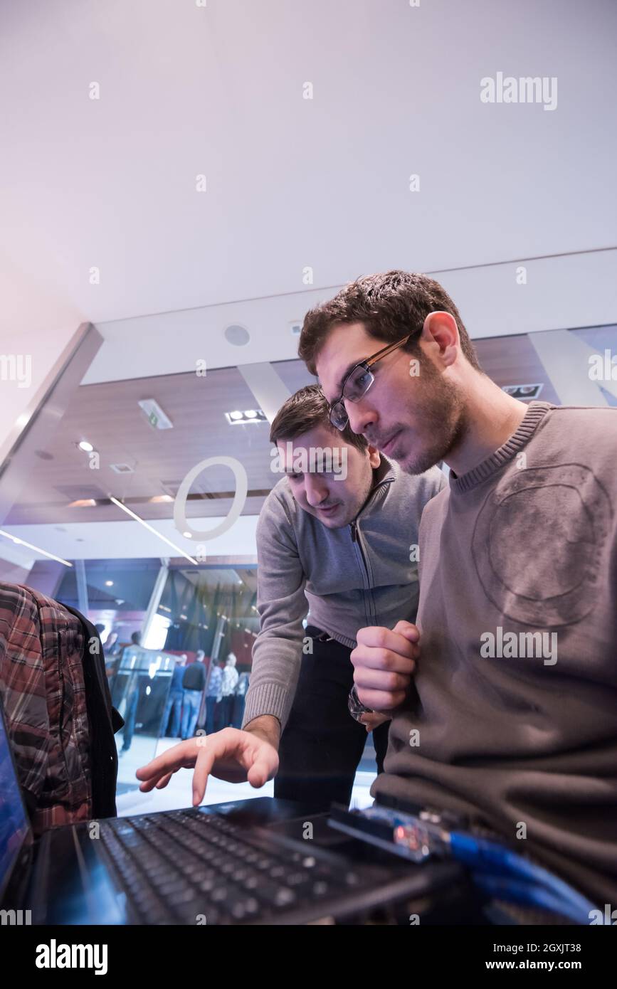 young computer technology students on code programming class have ...