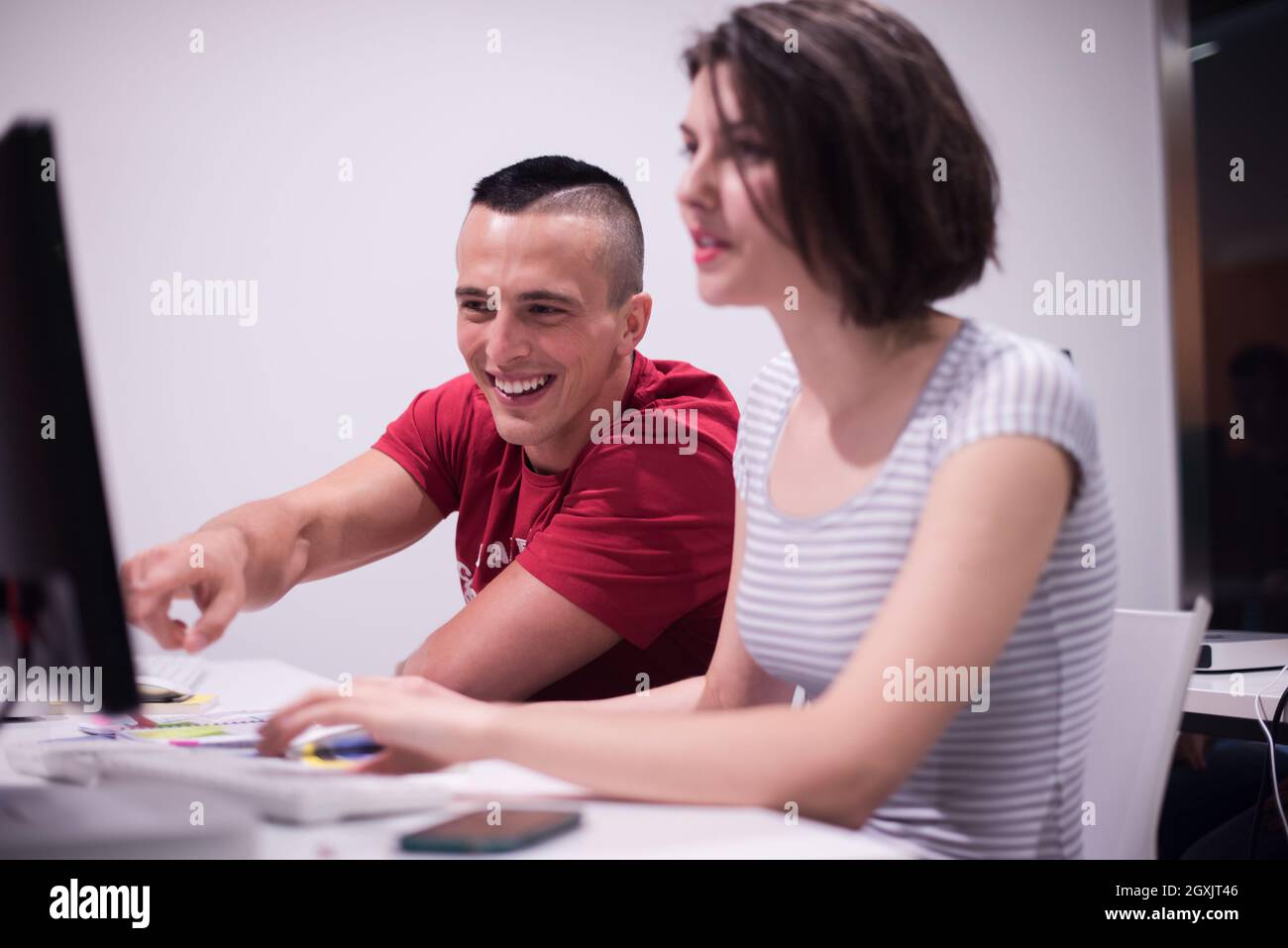 technology students group in computer lab school classroom working on ...