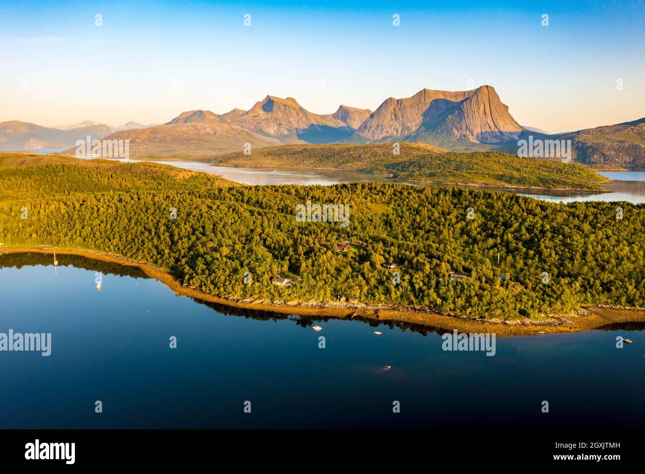 Aerial view over the fjord Efjord south of Narvik, seen at sunset ...