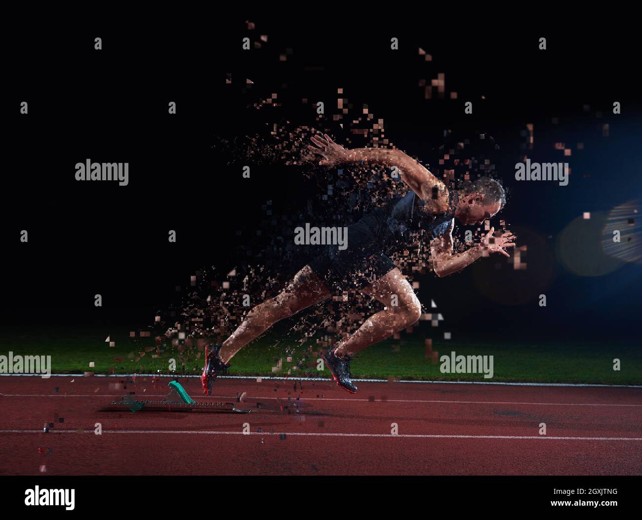 Sprinter leaving starting blocks on the running track. Explosive start ...