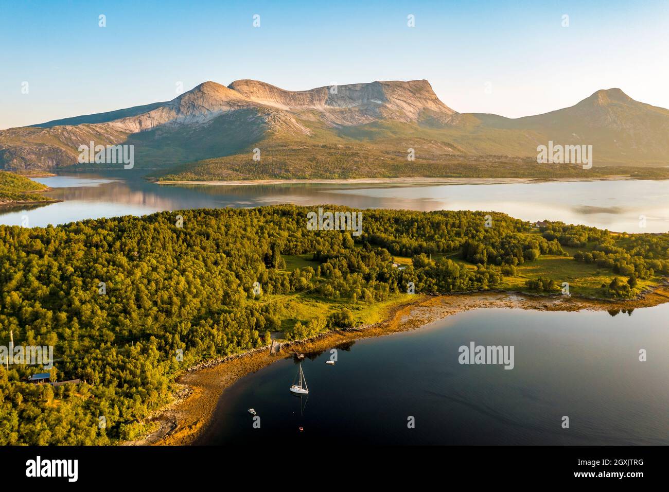 Aerial view over the fjord Efjord south of Narvik, seen at sunset ...