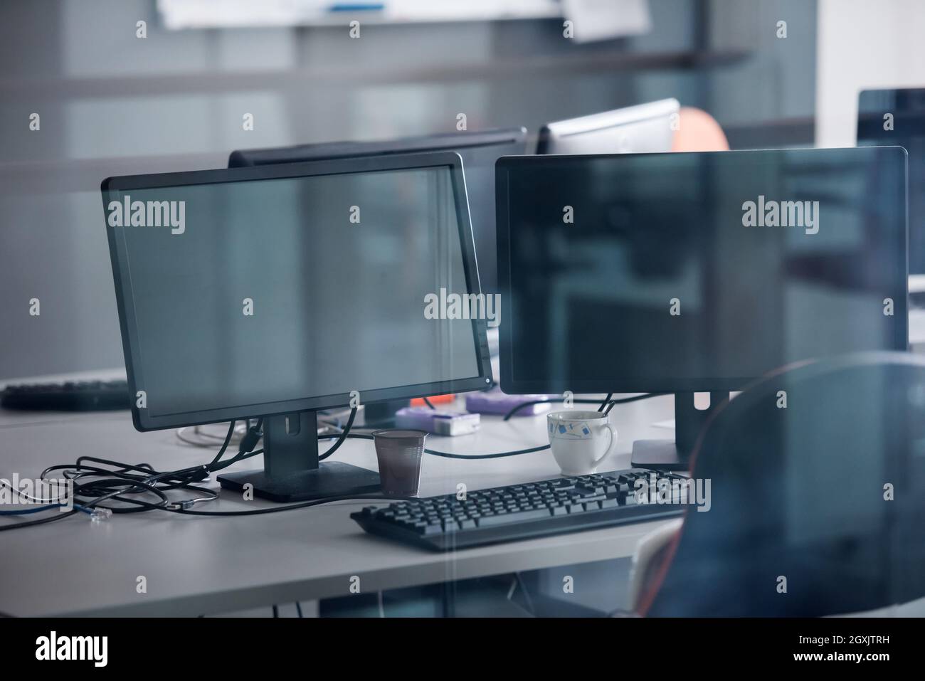 empty startup office interior with modern computers and dual screen ...