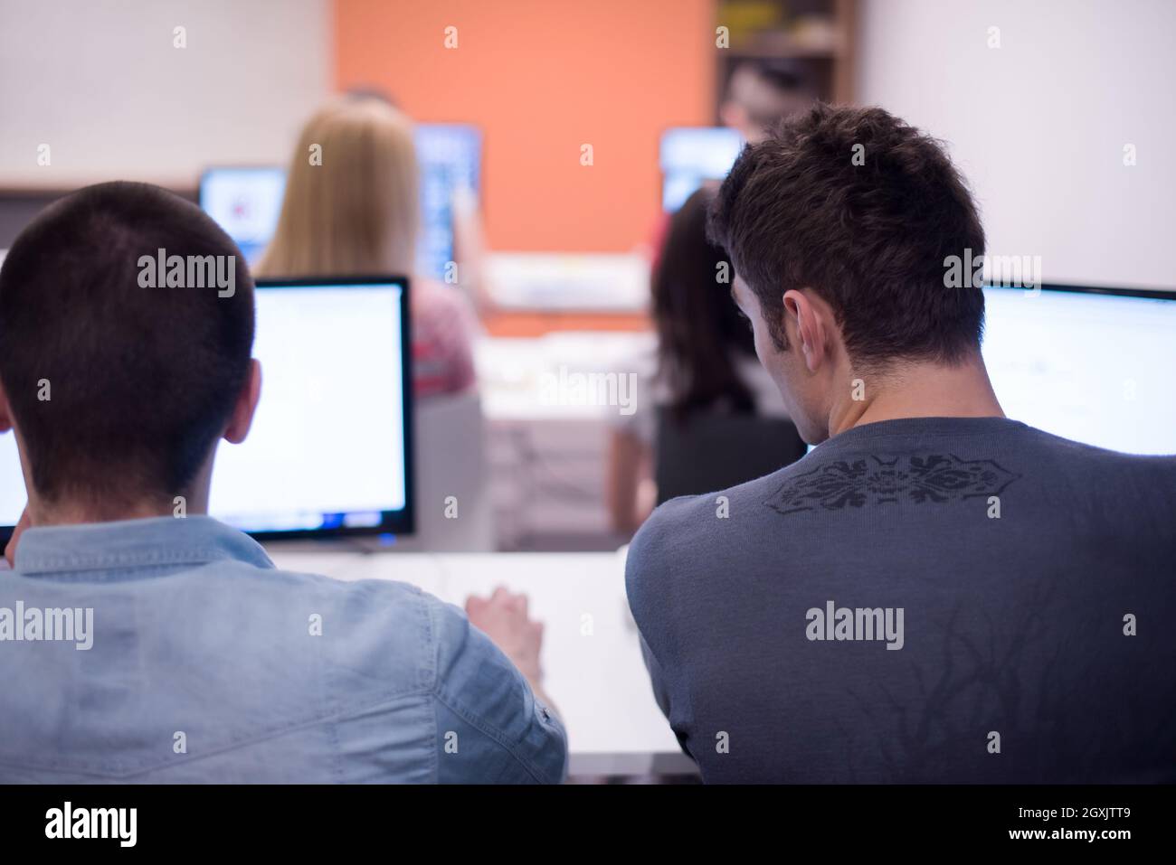 technology students group in computer lab school classroom working on ...