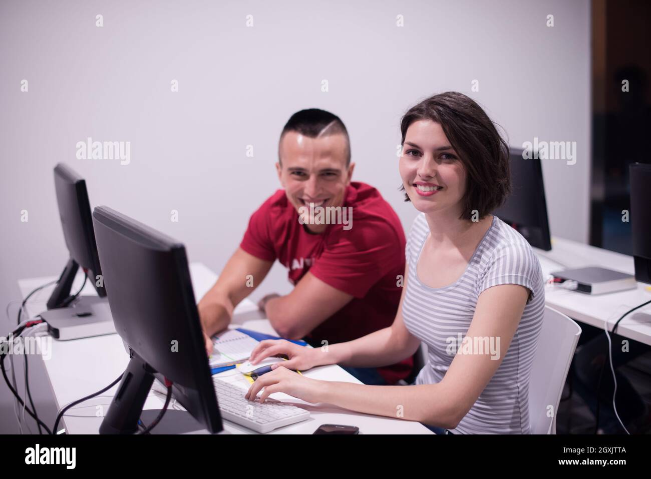 technology students group in computer lab school classroom working on ...
