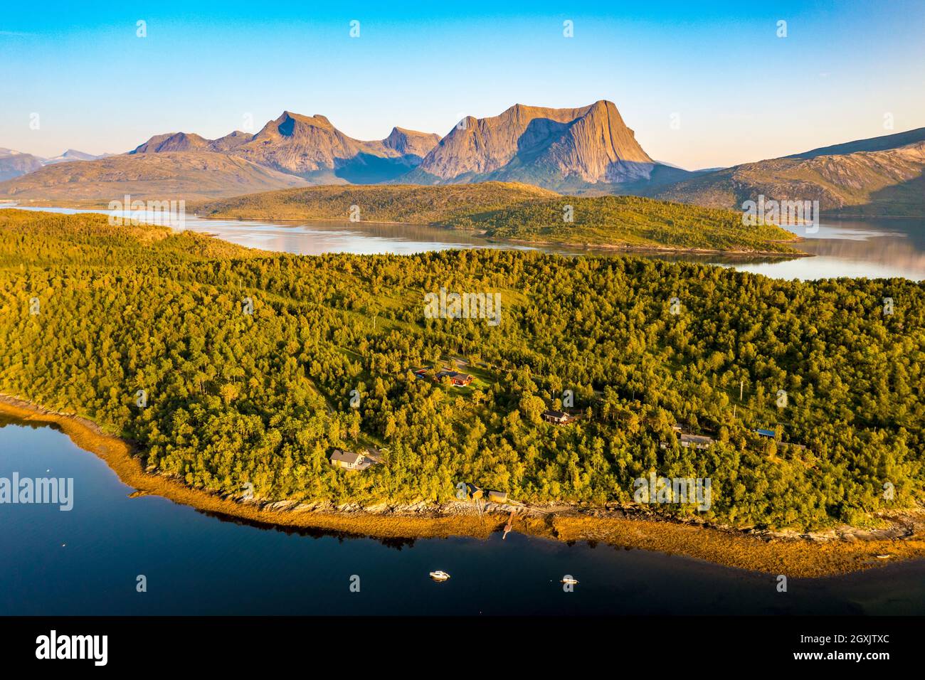 Aerial view over the fjord Efjord south of Narvik, seen at sunset ...