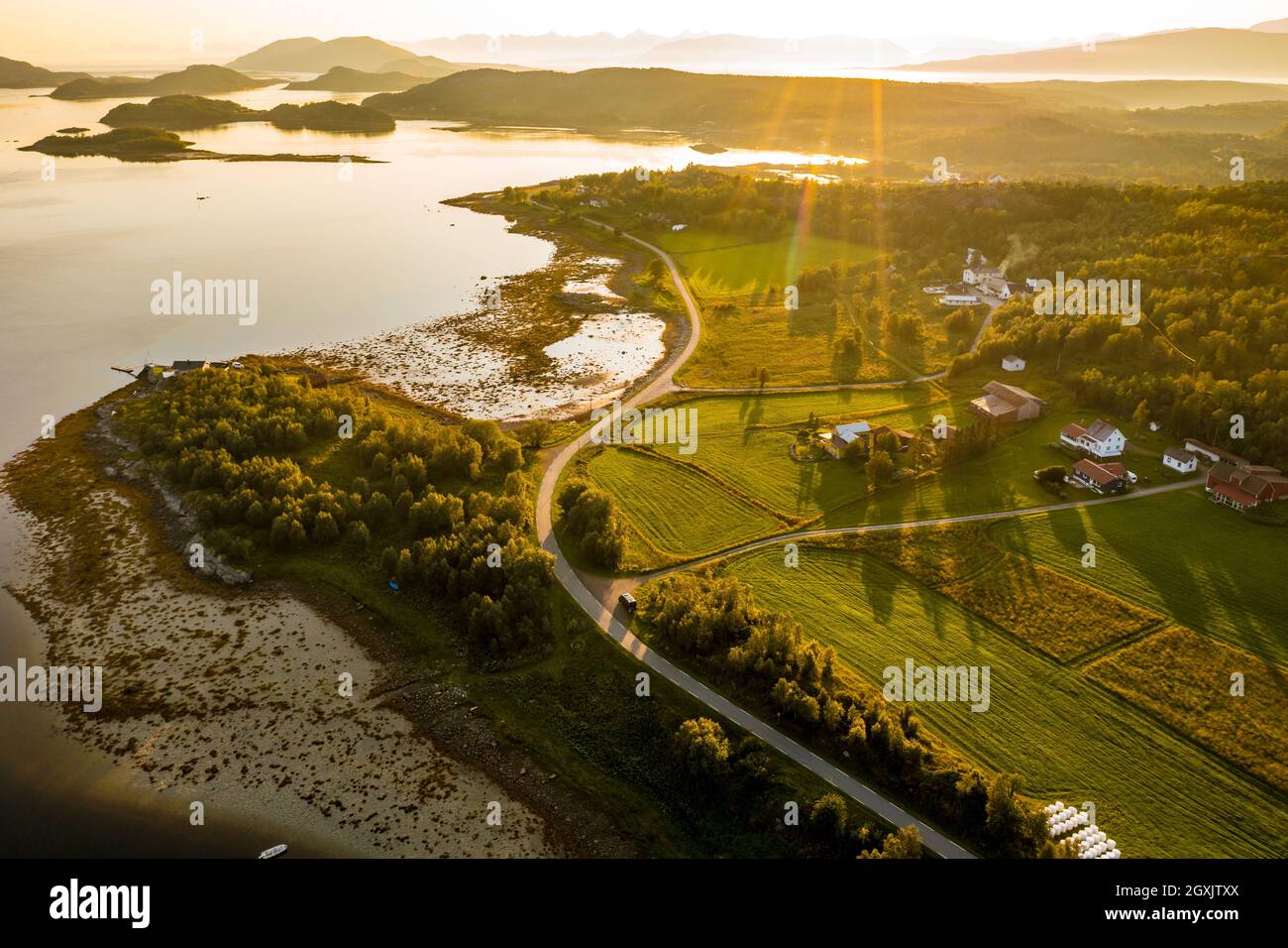 Aerial view over the fjord Efjord south of Narvik, seen at sunset ...