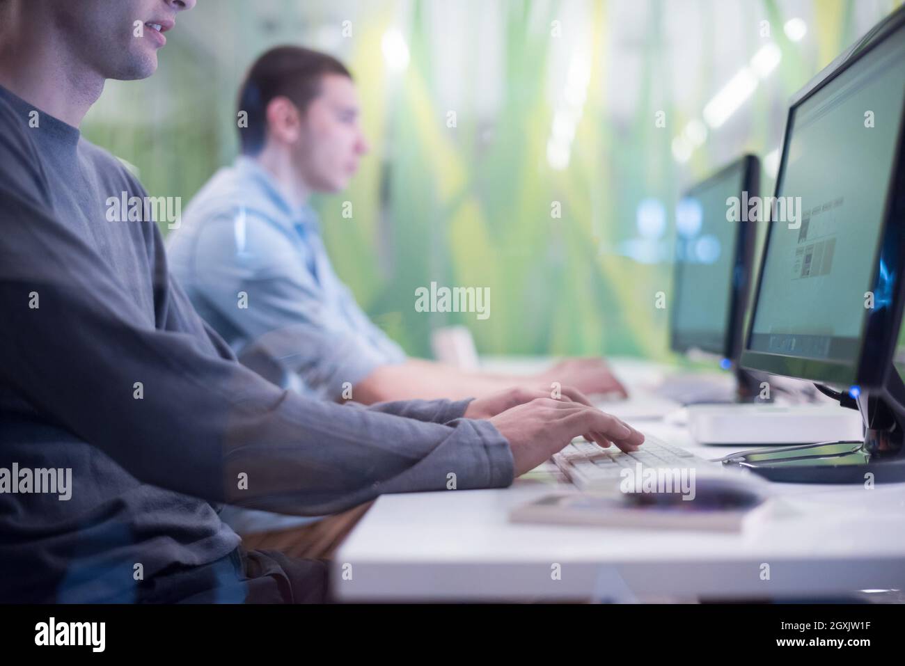 technology students group in computer lab school classroom working on ...