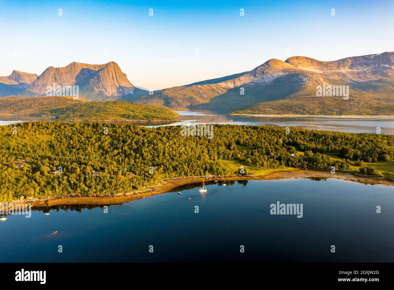Aerial view over the fjord Efjord south of Narvik, seen at sunset ...