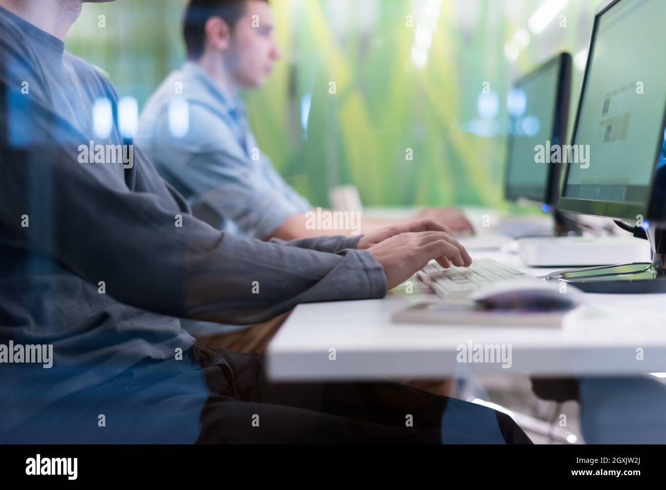 technology students group in computer lab school classroom working on ...