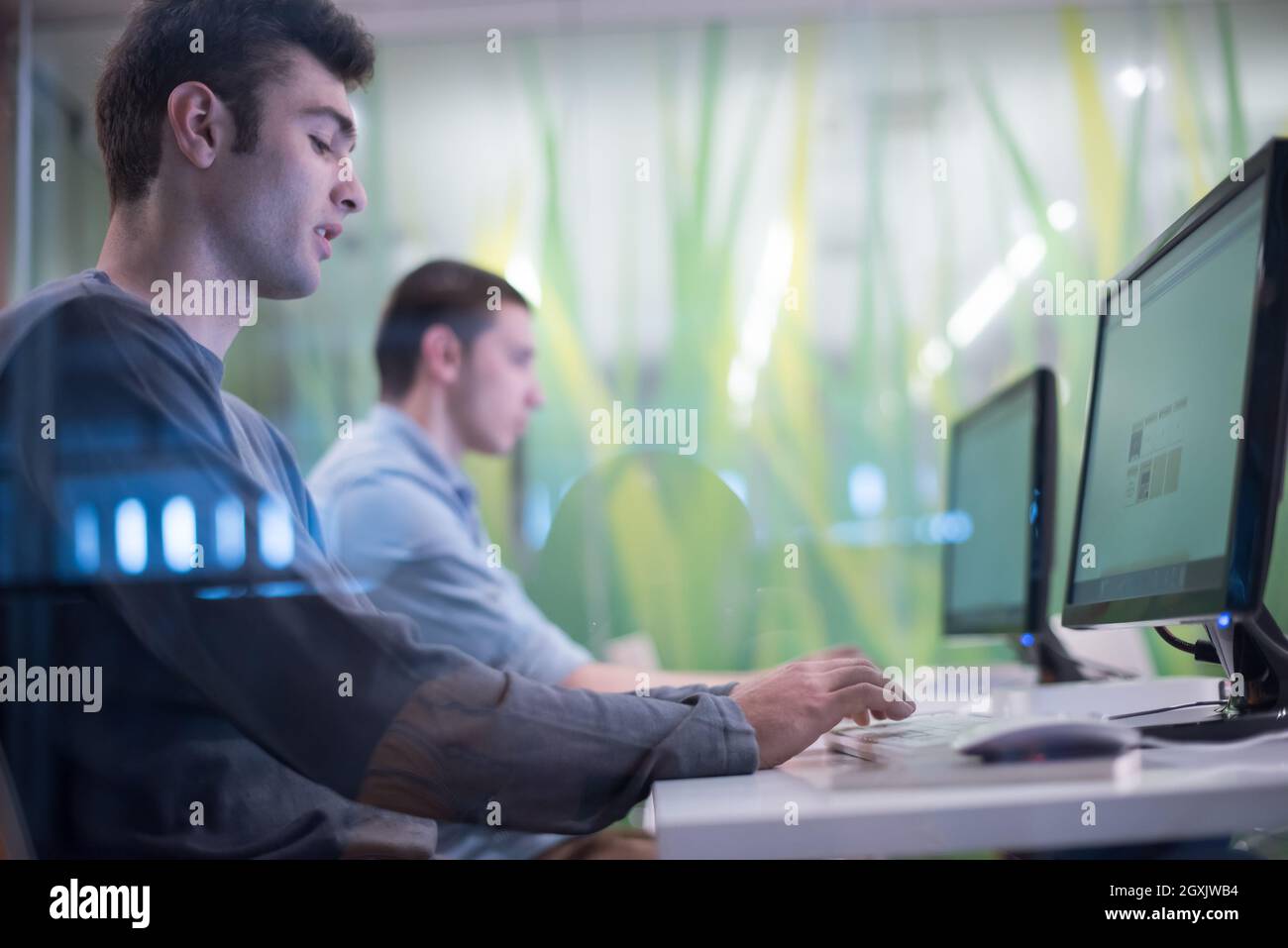 technology students group in computer lab school classroom working on ...